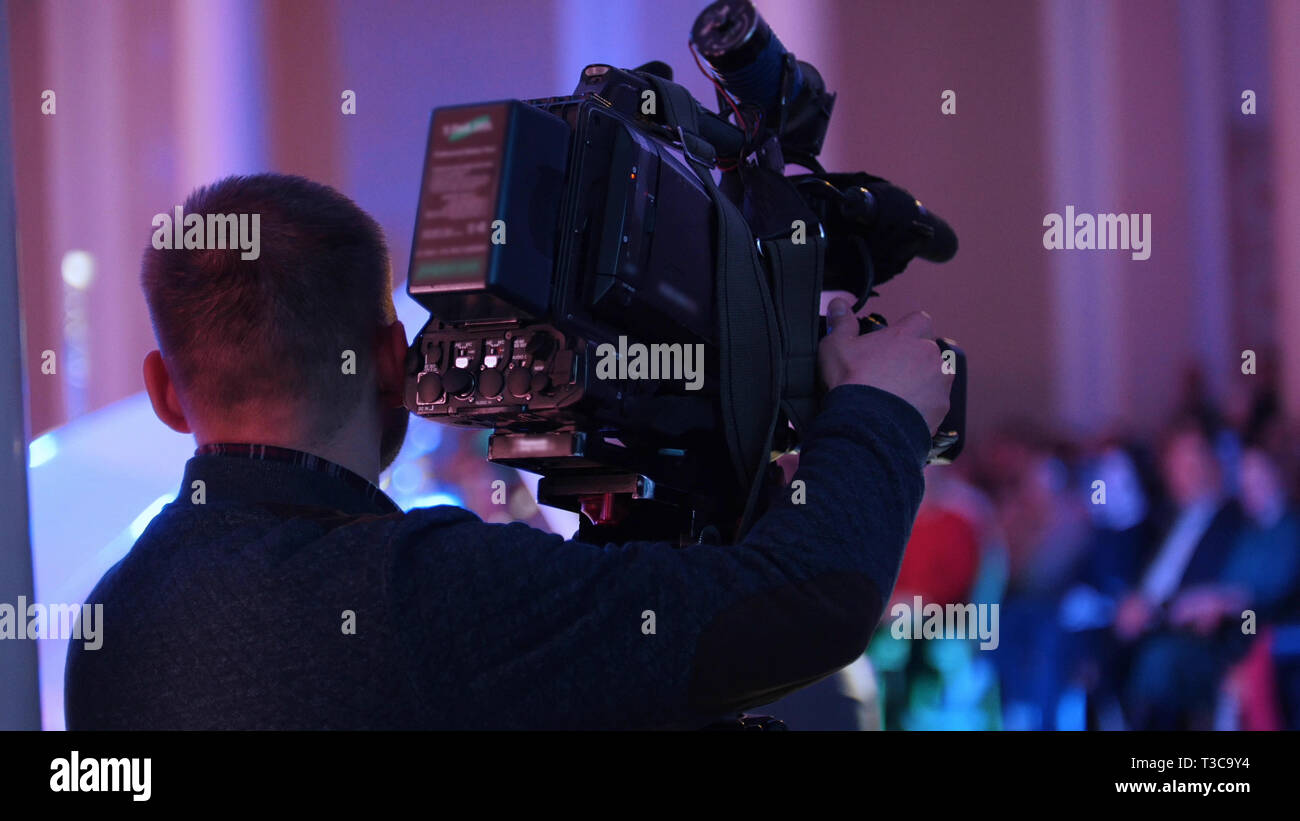 Cameraman filming the concert and the audience Stock Photo - Alamy