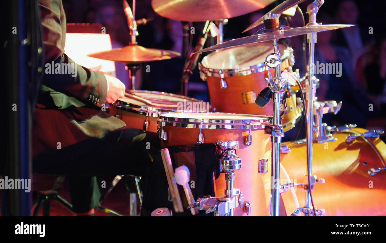 A man playing drums at the jazz concert. Back view Stock Photo - Alamy