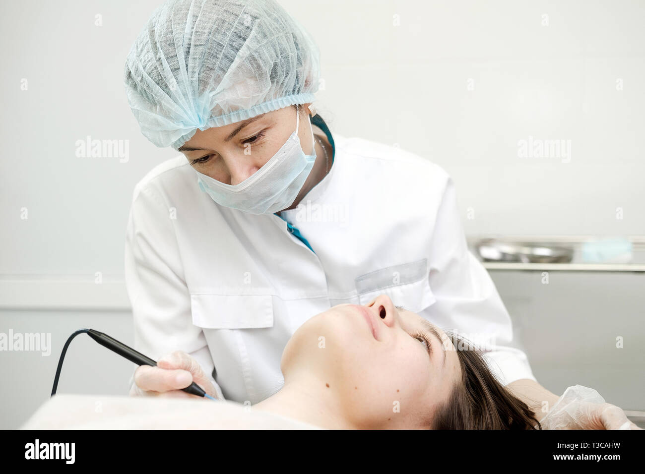 Medical treatment removal of birthmark from female patient's neck ...