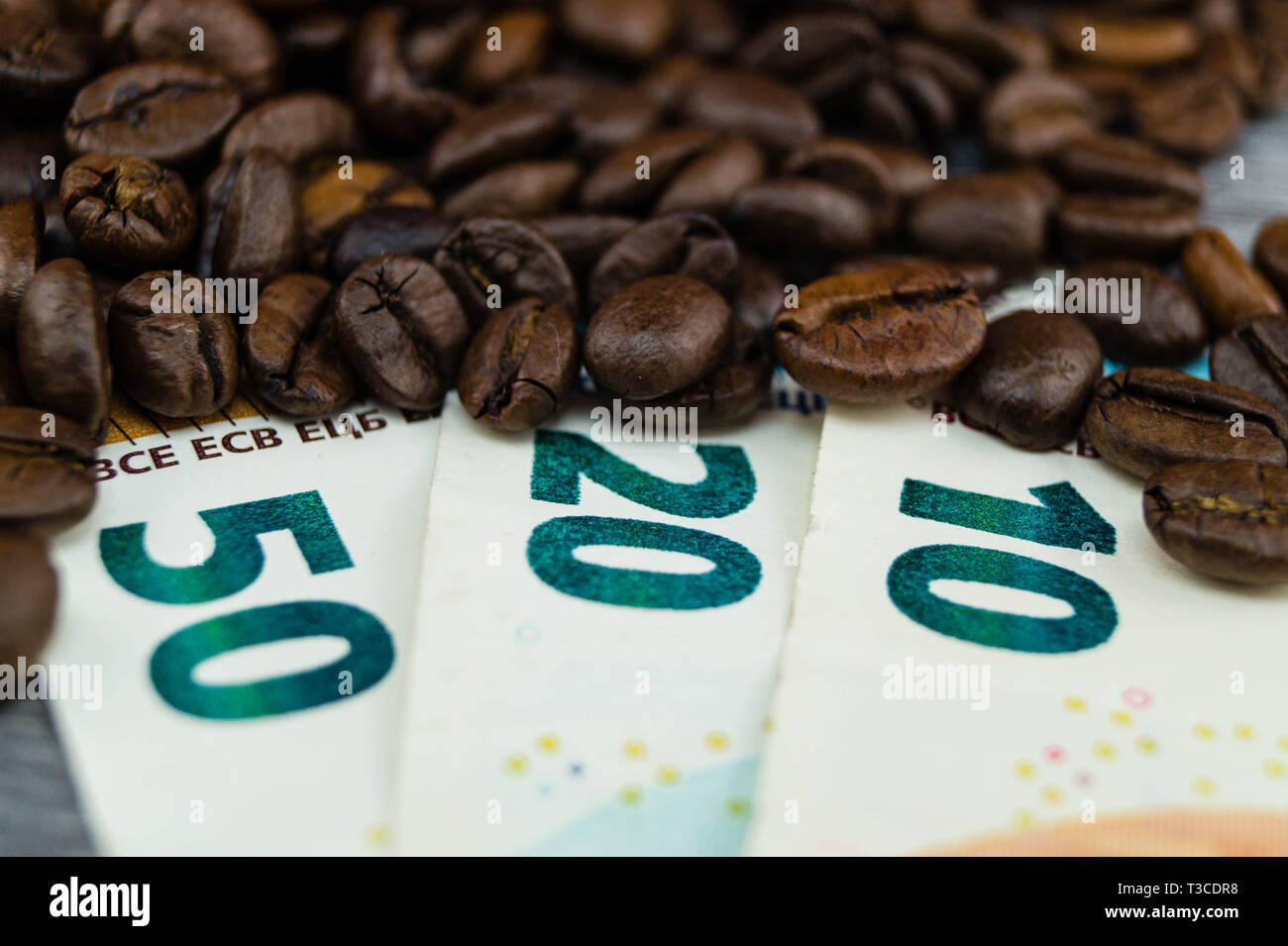 fair trade coffee Price - roasted coffee beans and money Stock Photo ...