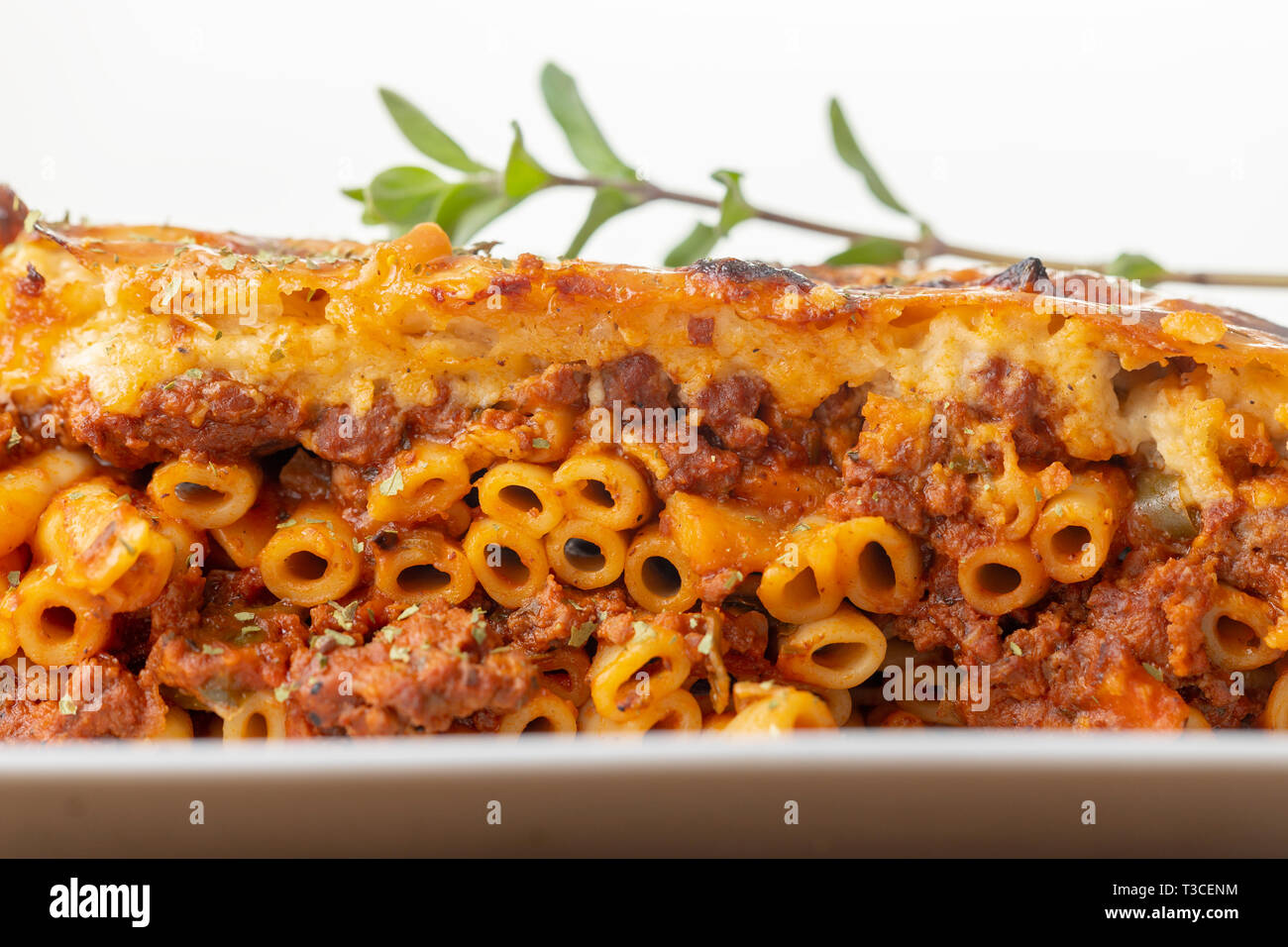 greek pastizio noodle dish with cheese Stock Photo - Alamy
