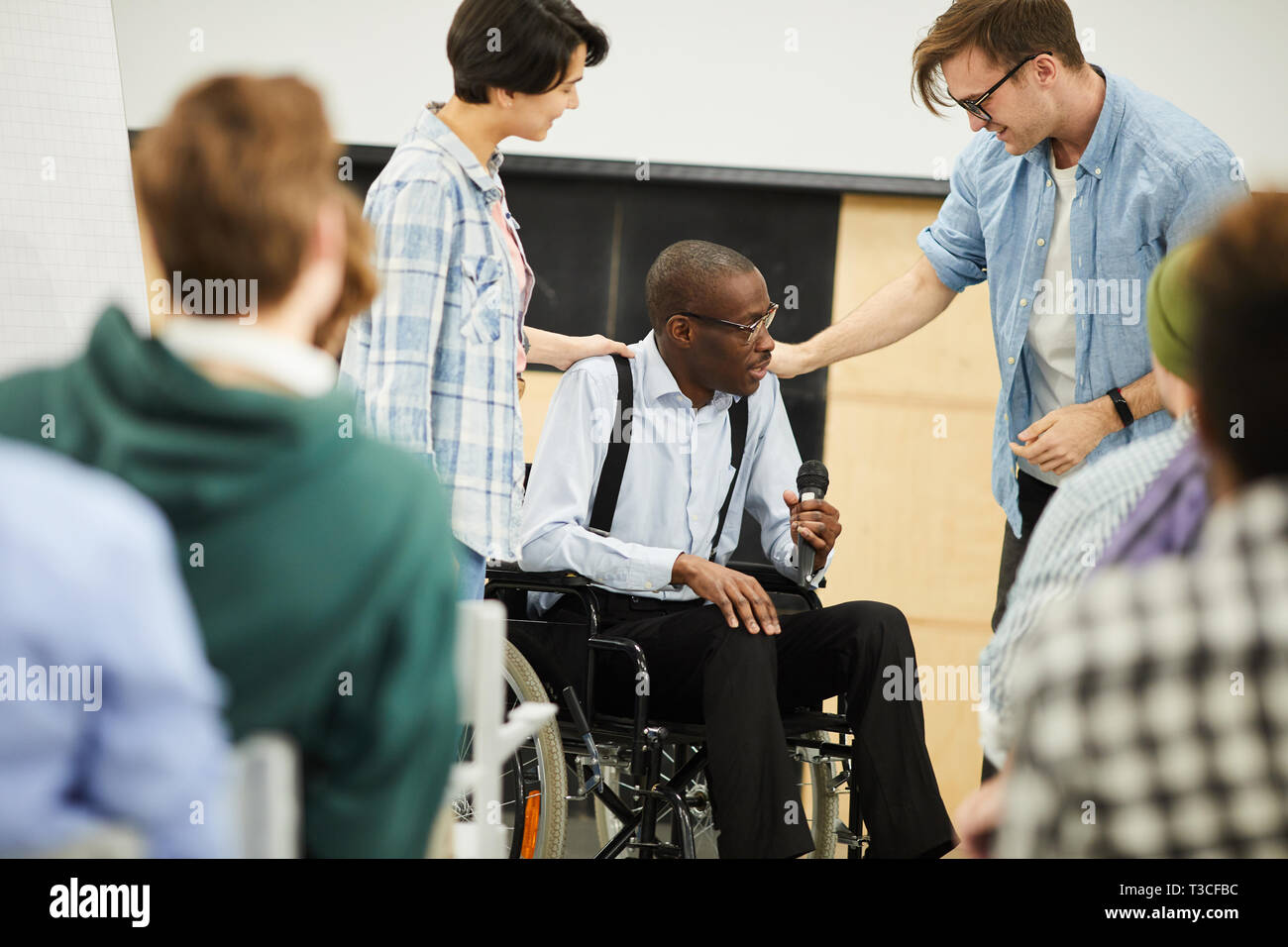 Disabled black man in wheelchair giving lecture at conference Stock ...