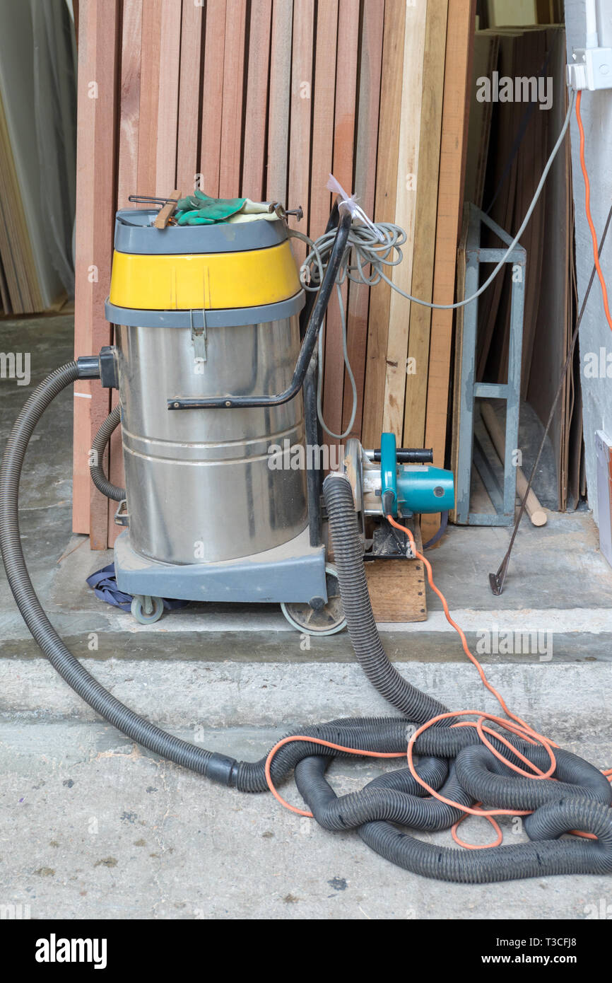 Circular Saw With Big Industrial Vacuum Cleaner in Wood Work Shop Stock ...