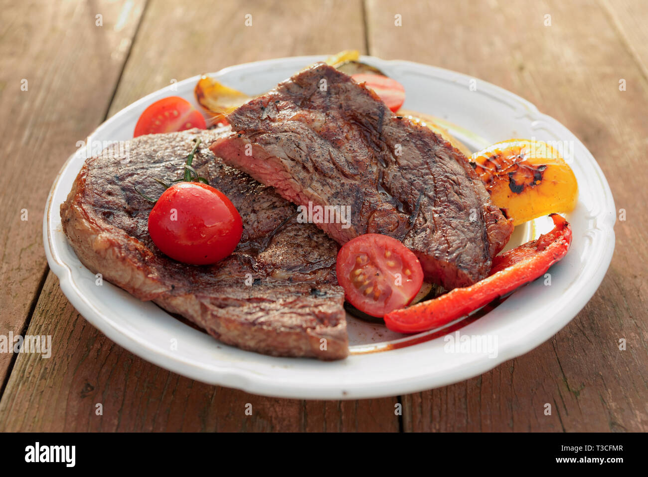 Kobe beef ribeye steak with grilled vegetables on old table Stock Photo ...
