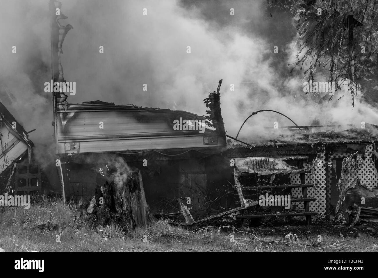 picture of trailer camper fire with burnt wood and debris Stock Photo ...