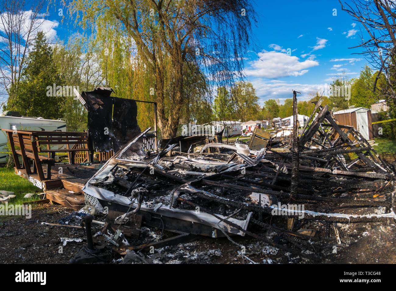 picture of trailer camper fire with burnt wood and debris Stock Photo ...