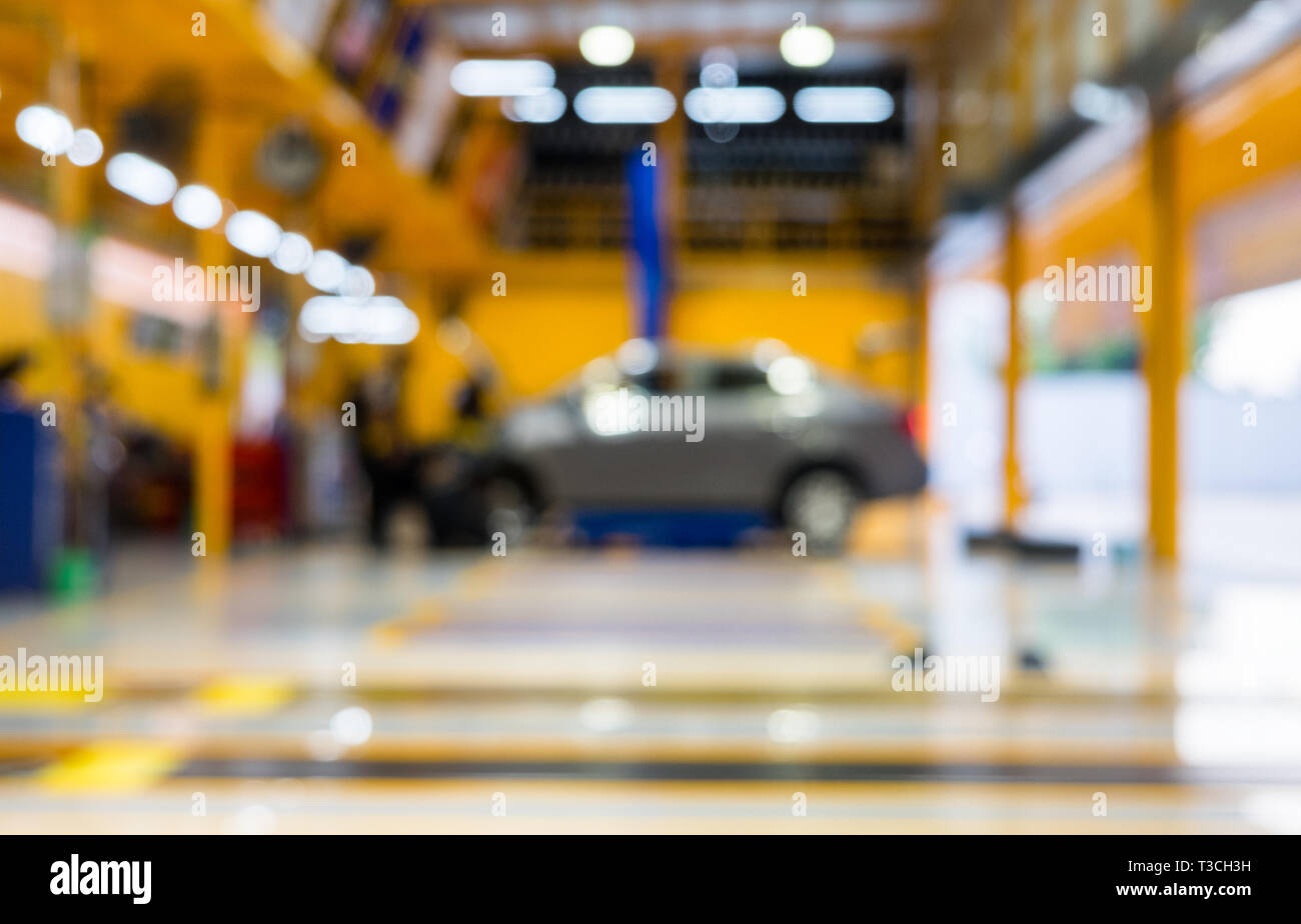 Blurred scene of inside car garage with maintenance and fixing Stock ...