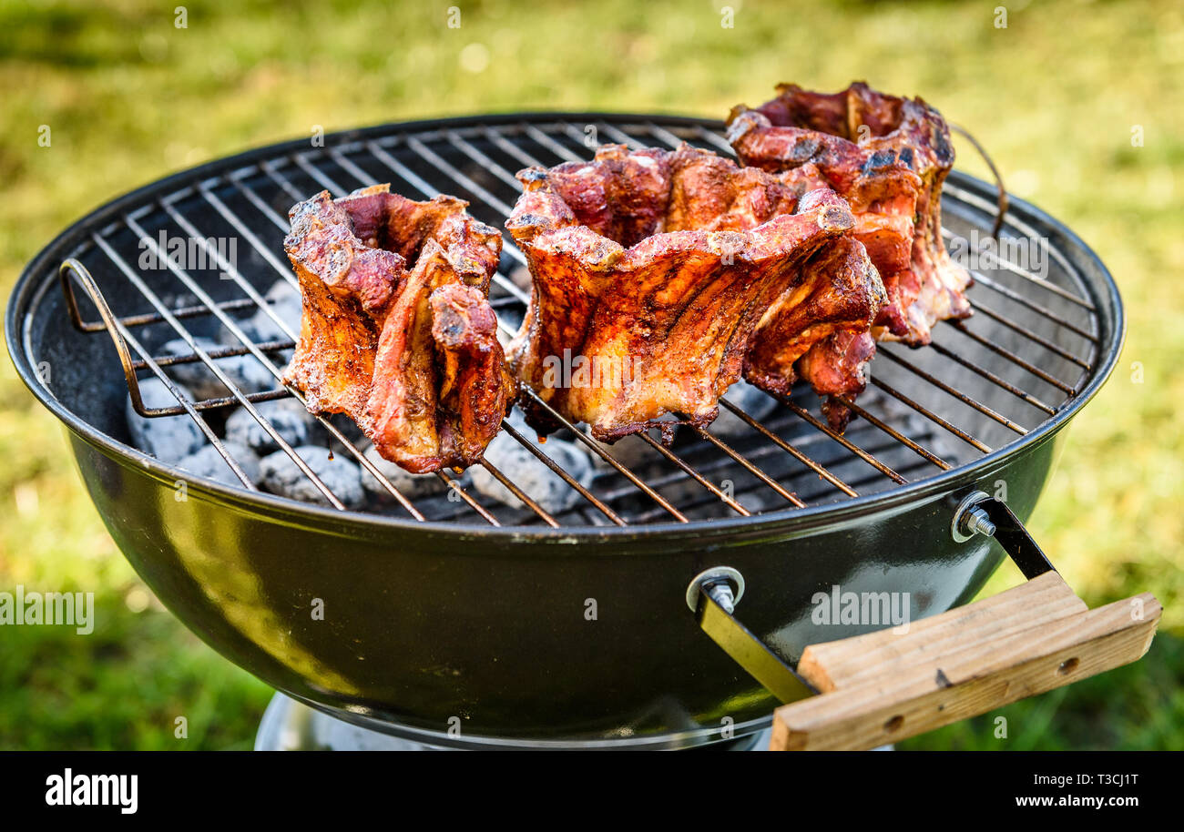Baby Back Ribs Crown Roast on BBQ barbecue kettle grill. Home made pork ...
