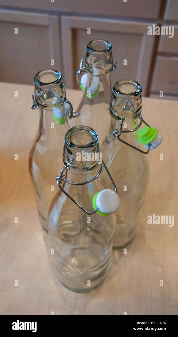 Still life of a kitchen scene of 4 empty glass bottles, 1 liter each ...