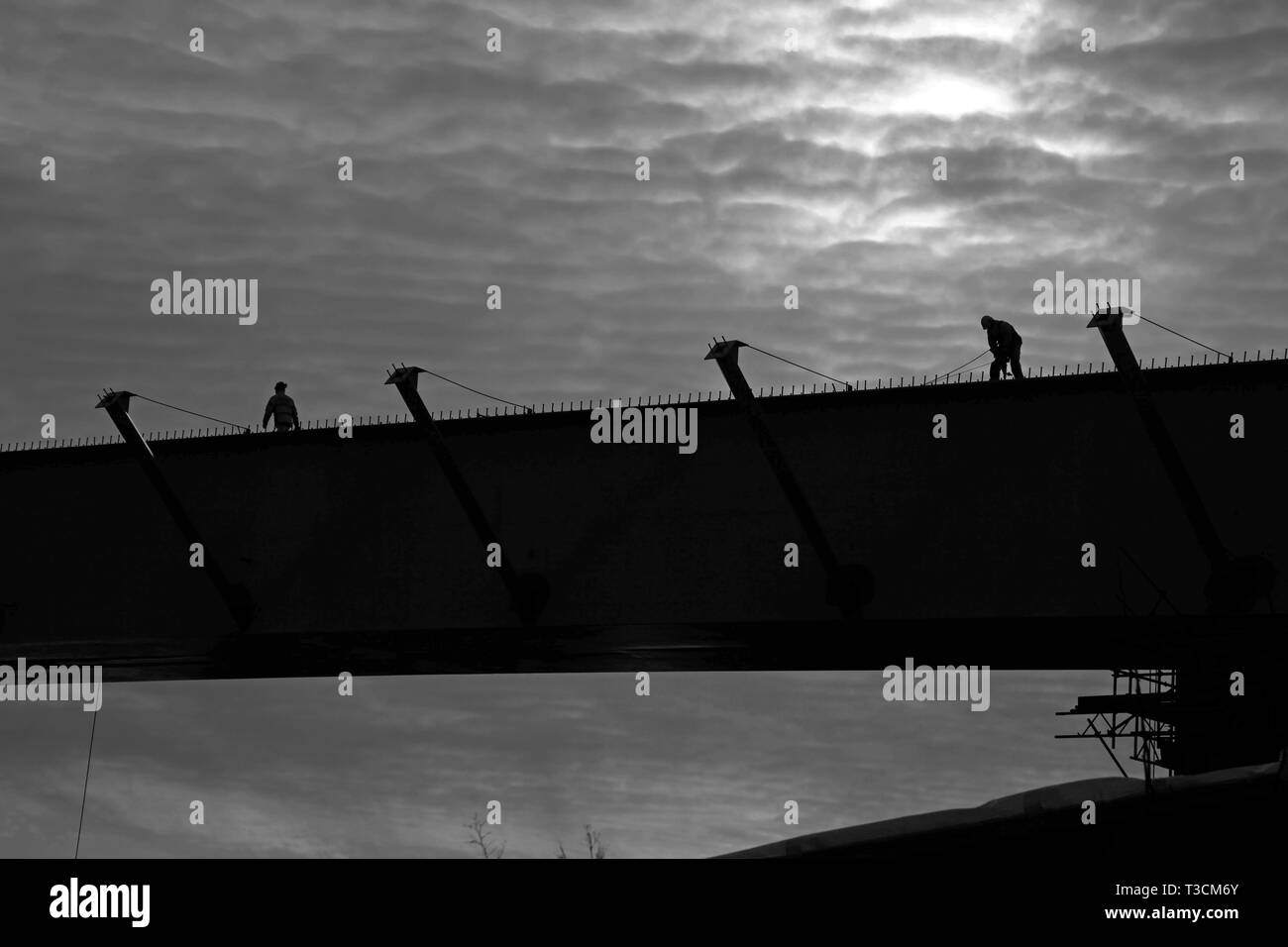 Construction worker on the building of a bridge Stock Photo - Alamy