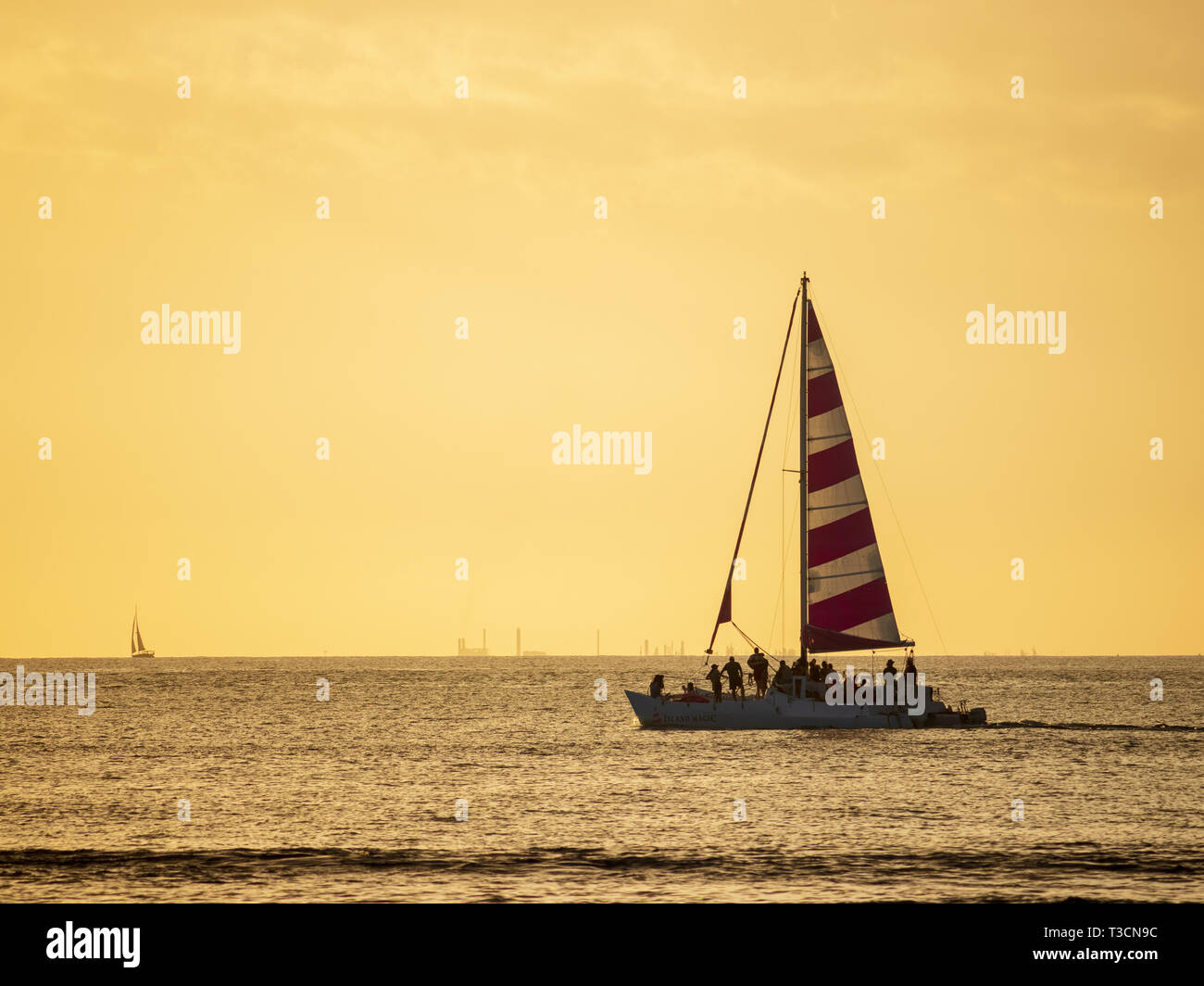Sailboat at Sunset in Ocean Stock Photo - Alamy