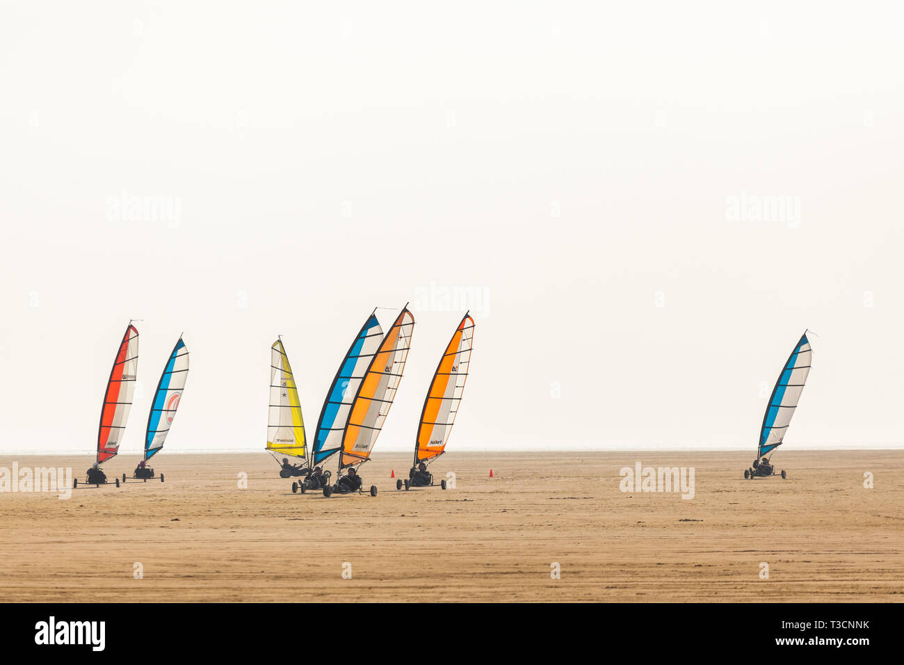 A group of land yachts racing on a beach Stock Photo - Alamy