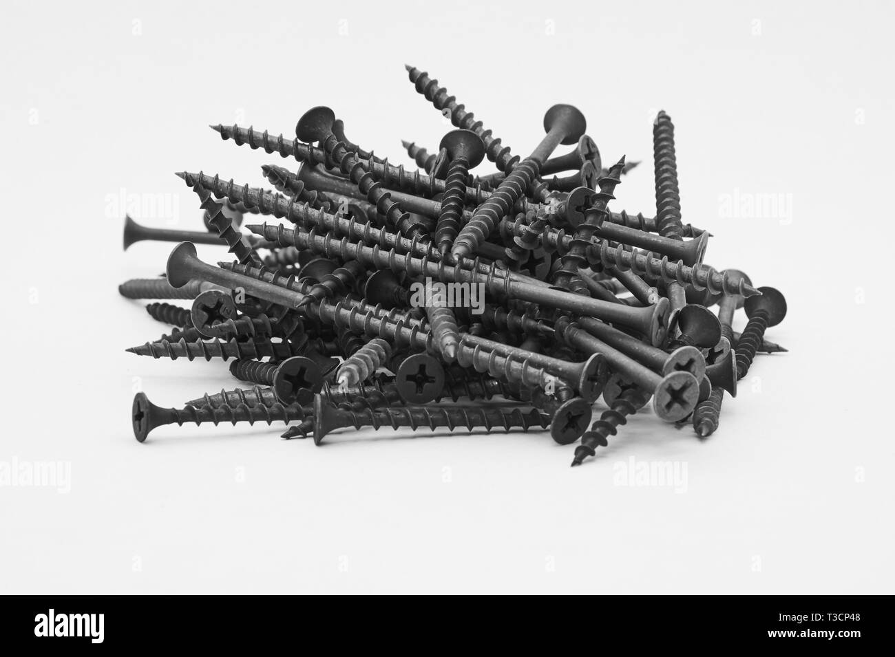 a bunch of screws isolated on white background Stock Photo - Alamy