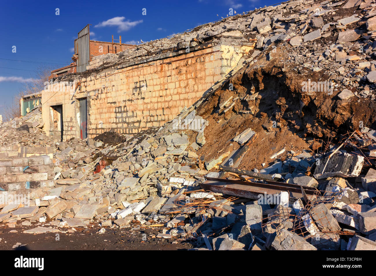 The ruins of a destroyed building in the city against the backdrop of a ...