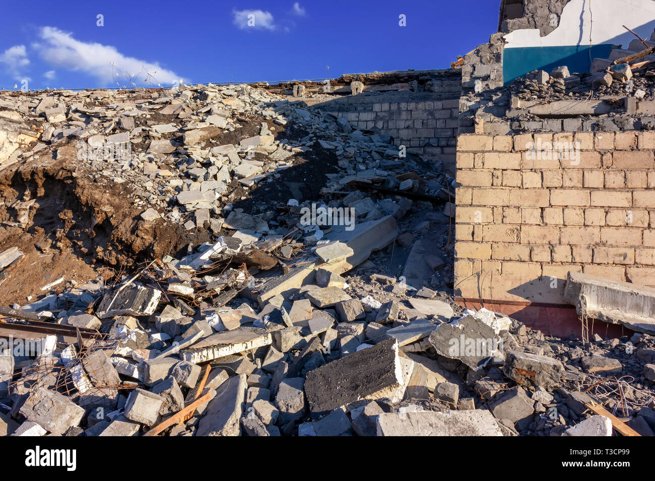 The ruins of a destroyed building in the city against the backdrop of a ...