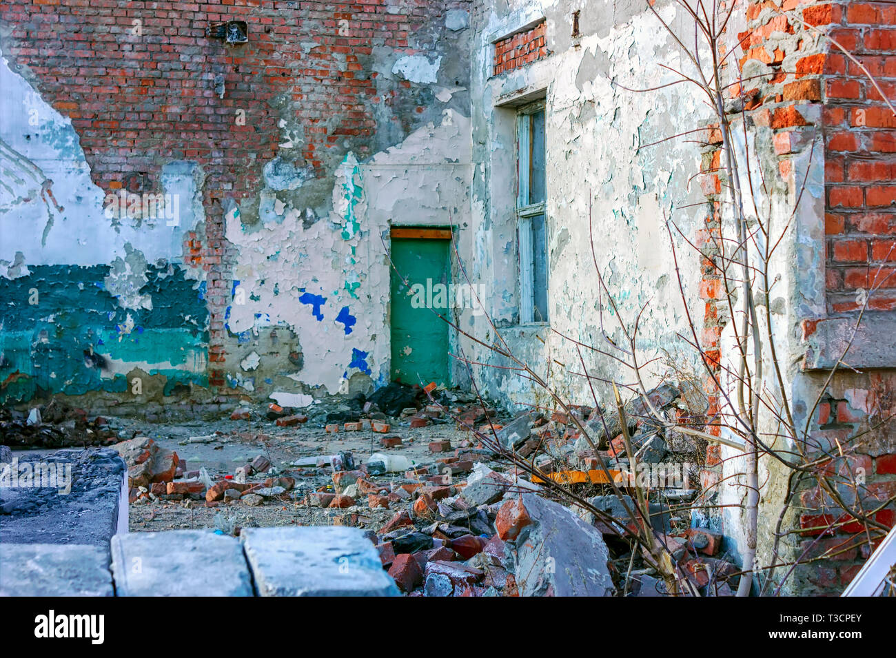 The ruins of a destroyed building in the city against the backdrop of a ...