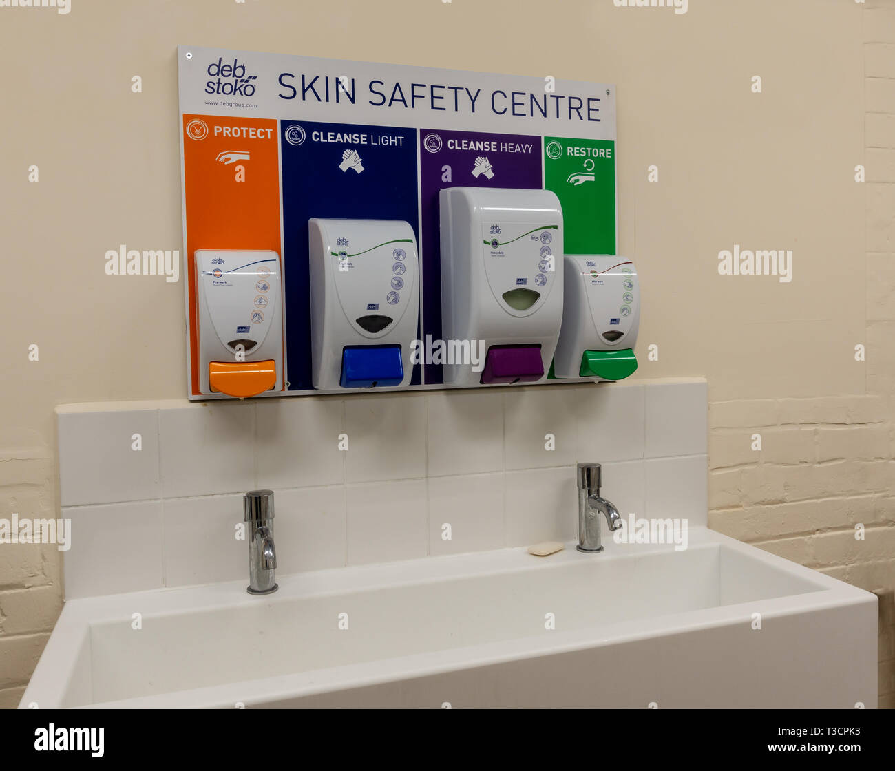 Stoko Skin Safety Centre cream dispensers on a wall in a works welfare ...