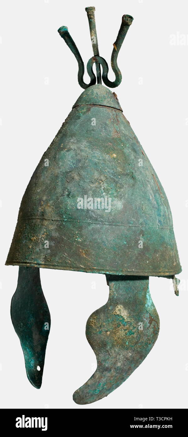 A Hellenistic Pilos type helmet with cheek pieces, 4th century B.C. A ...