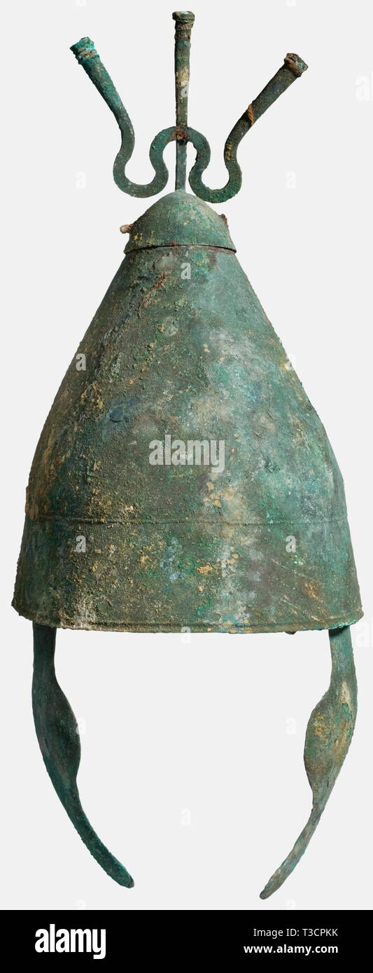 A Hellenistic Pilos type helmet with cheek pieces, 4th century B.C. A ...