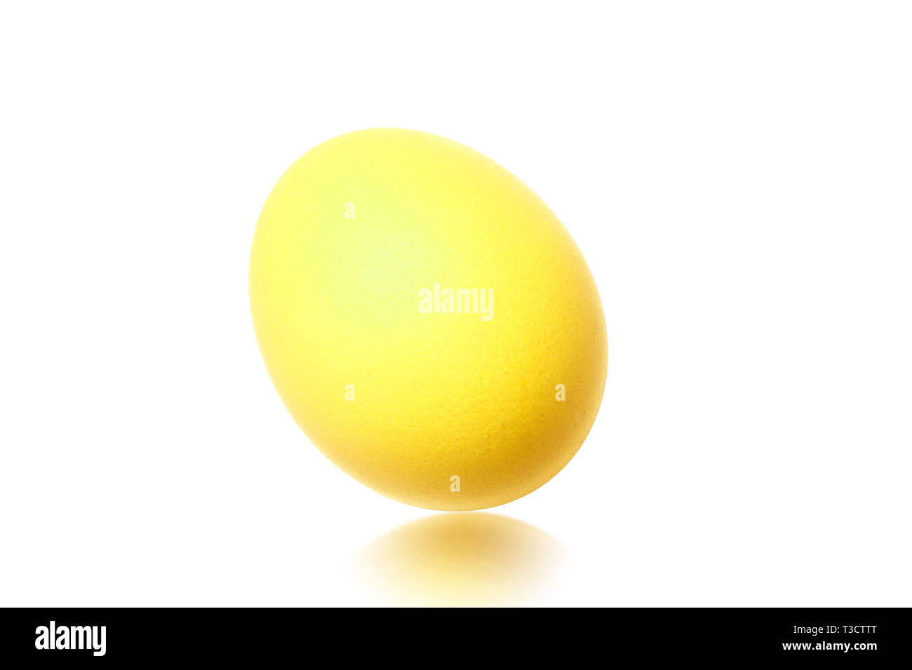 Yellow egg isolated on white background Stock Photo - Alamy