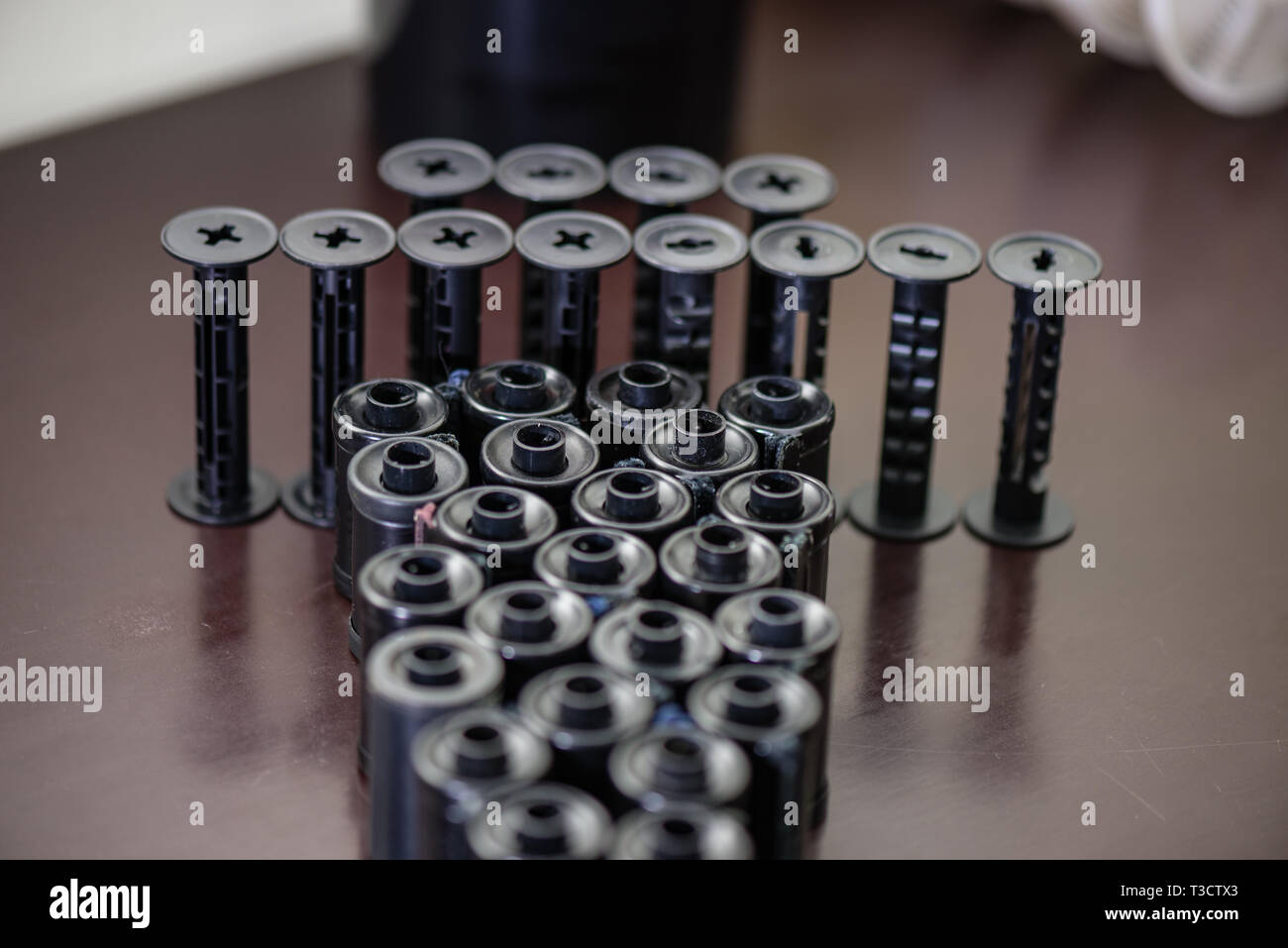 details of analog film laboratory equipment on the table. film rolls ...