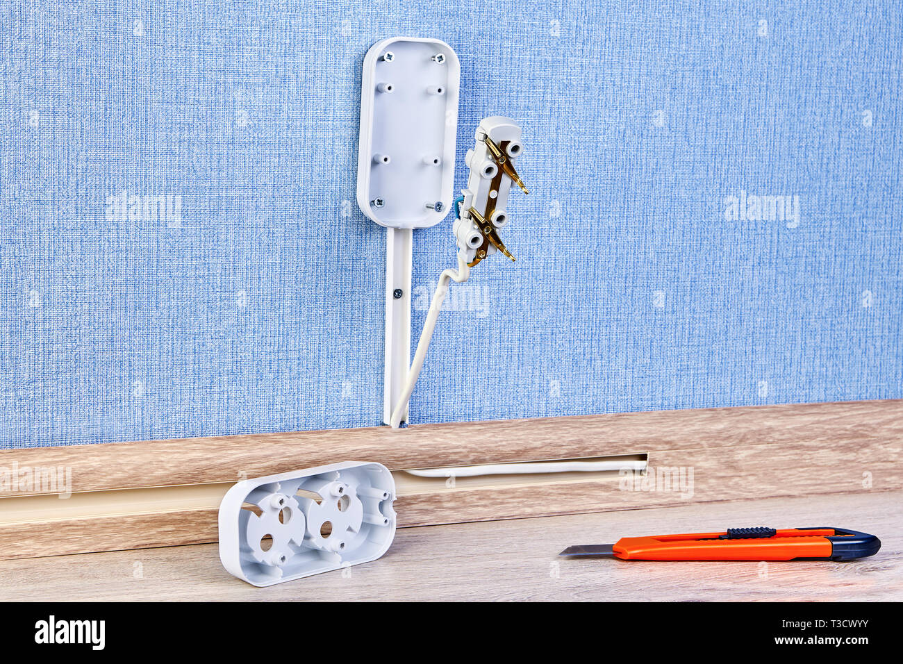 Duplex power outlet during installing, mounting electrical wall socket ...