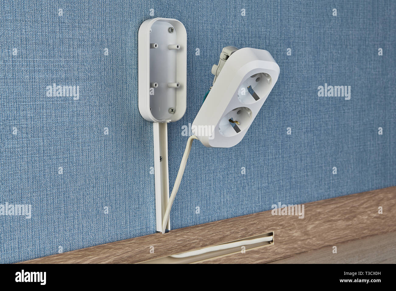Process of mounting new electrical wall socket with copy space ...