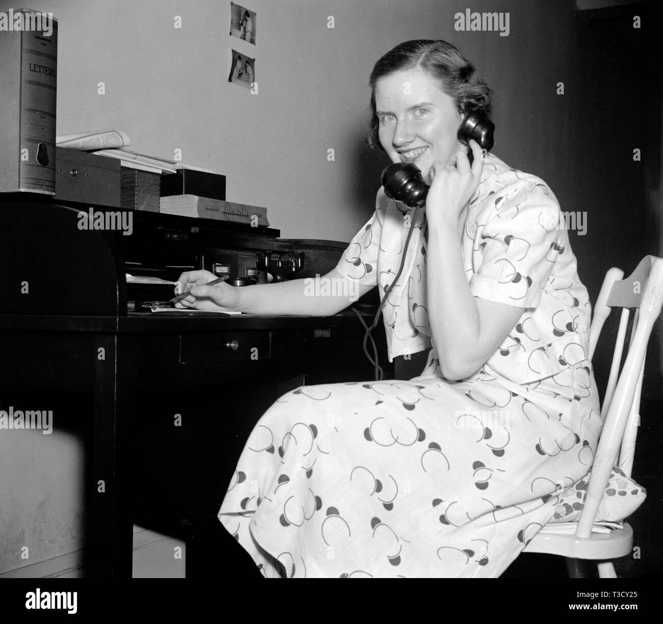 Woman talking on phone using Black and White Stock Photos & Images - Alamy