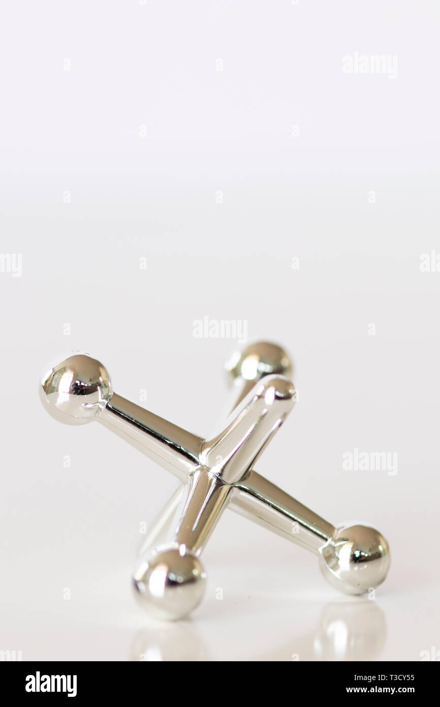 Single toy jack on white surface with copy space Stock Photo - Alamy