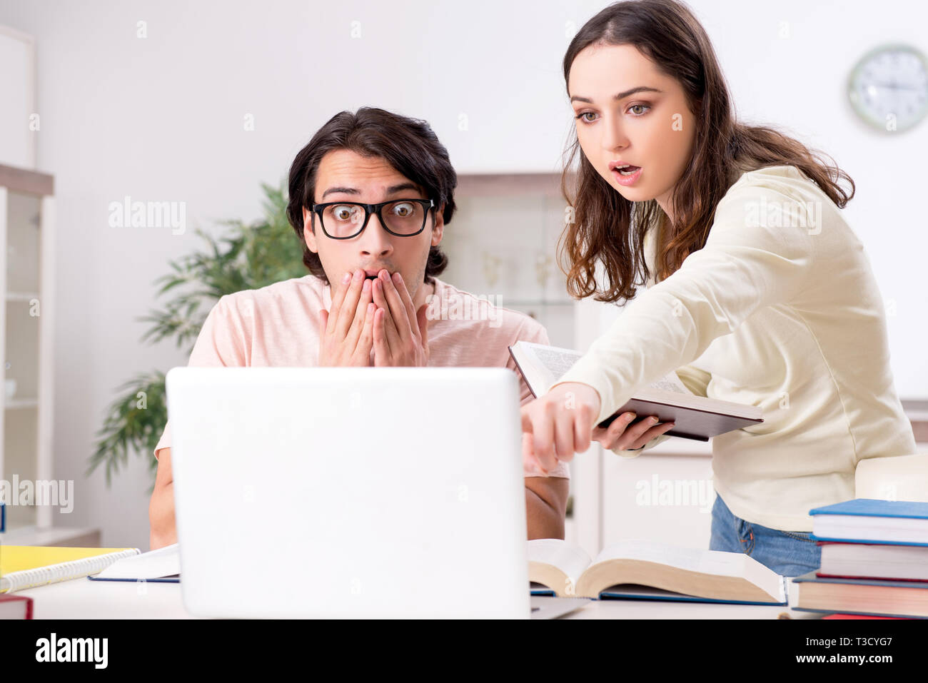 Students preparing for exam together at home Stock Photo - Alamy