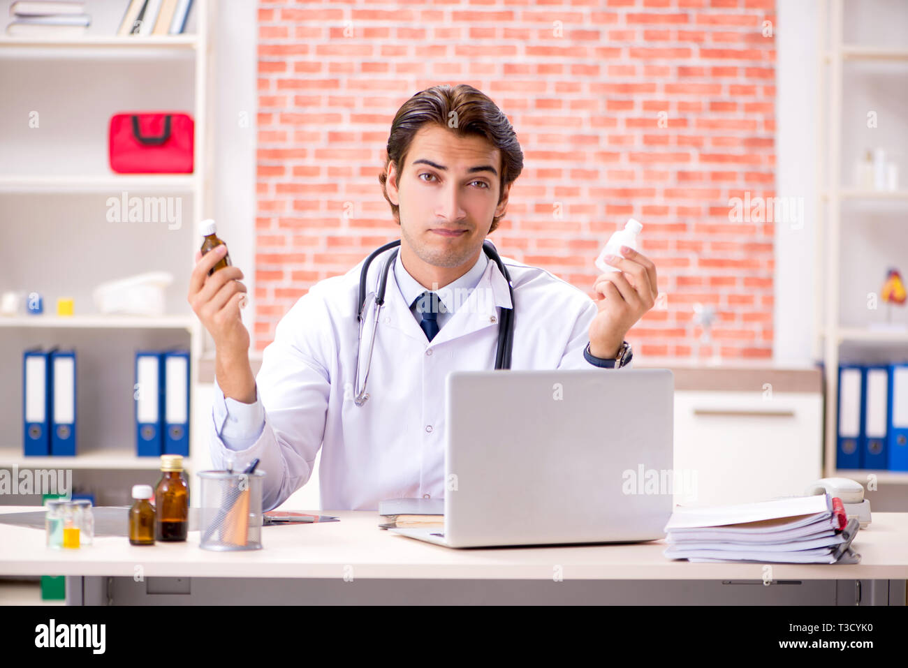 Young doctor working in hospital Stock Photo - Alamy