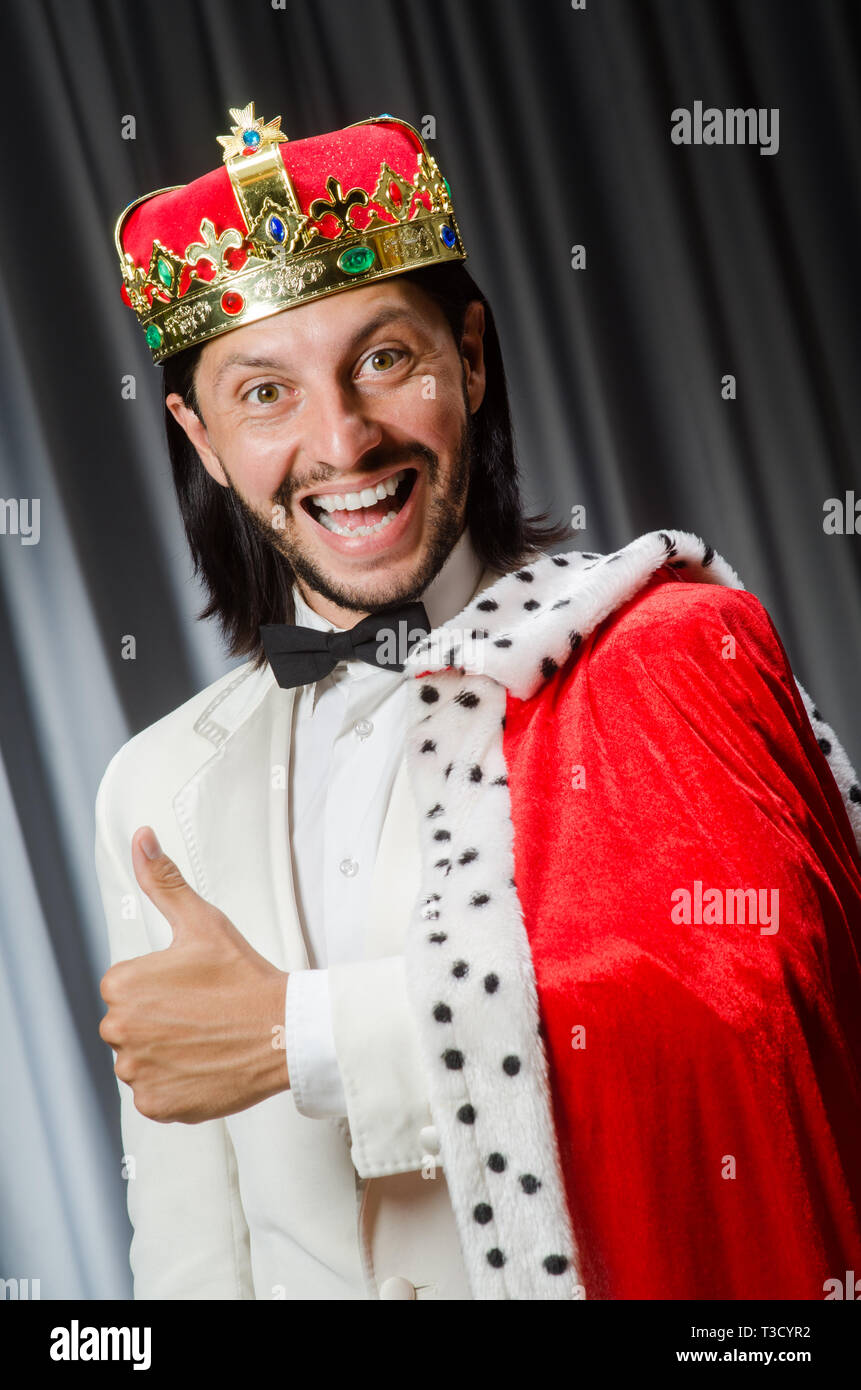 Funny king wearing crown in coronation concept Stock Photo - Alamy