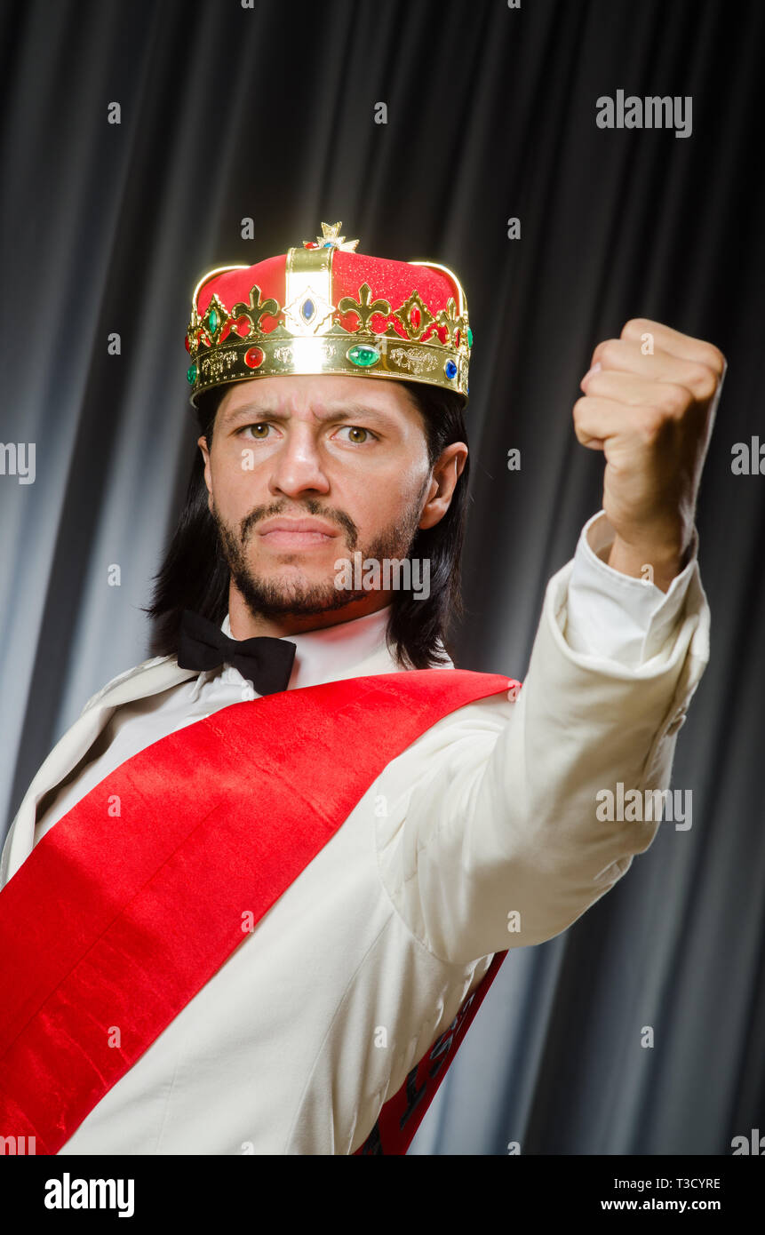 Funny king wearing crown in coronation concept Stock Photo - Alamy
