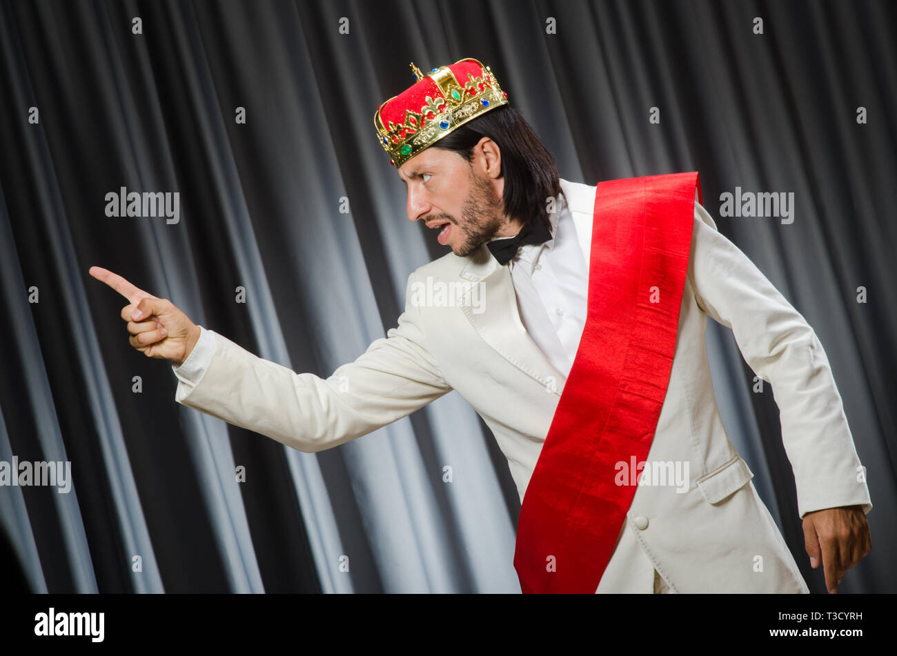 Funny king wearing crown in coronation concept Stock Photo - Alamy