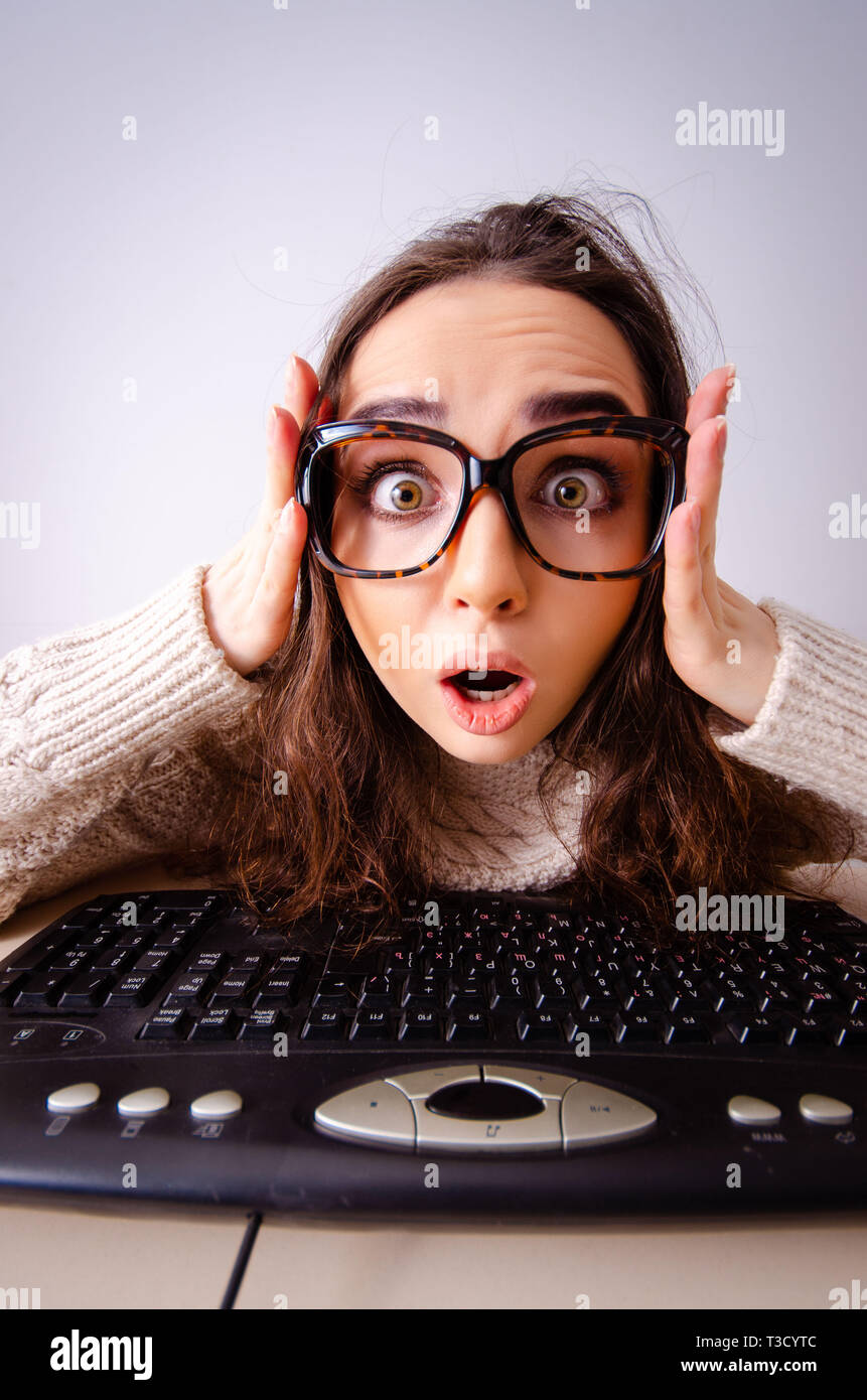 Funny nerd girl working on computer Stock Photo - Alamy