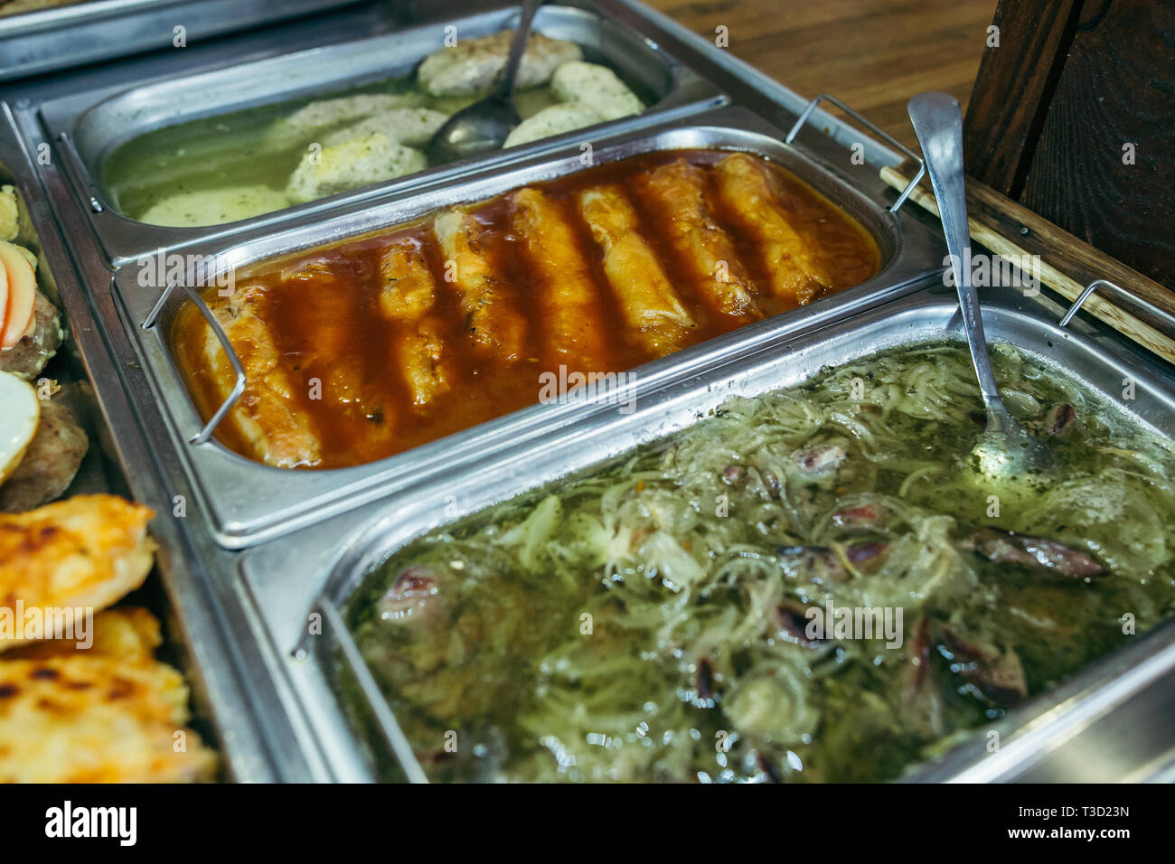 A set of meat dishes in the trays, a banquet table Stock Photo - Alamy
