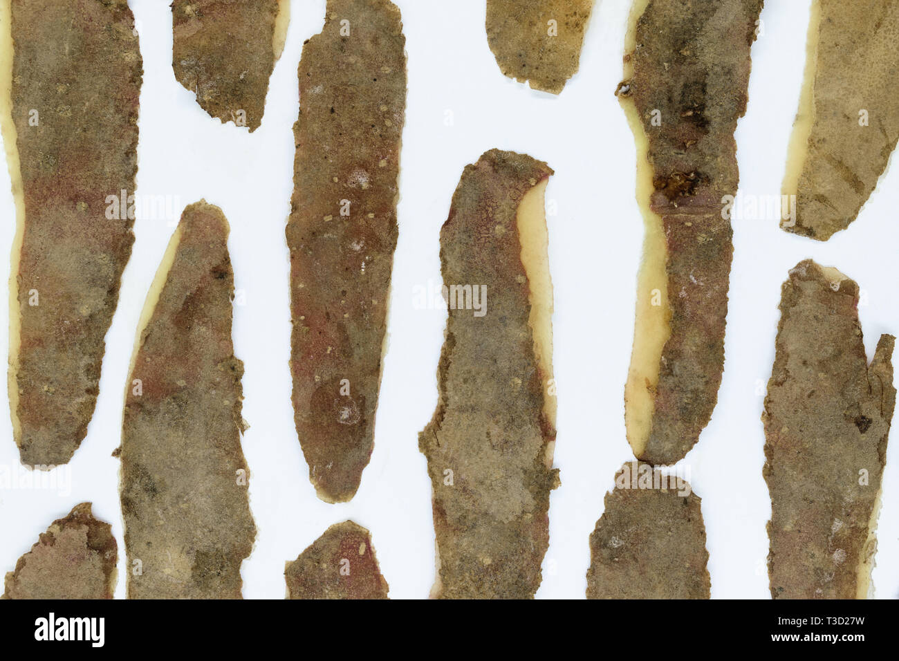 Abstract composition of potatoes peels, leftovers on white background ...