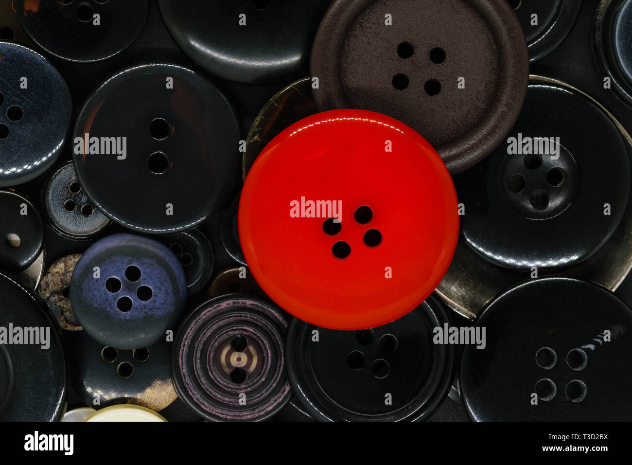 Various dark and colorful, plastic and metal clothes buttons background ...