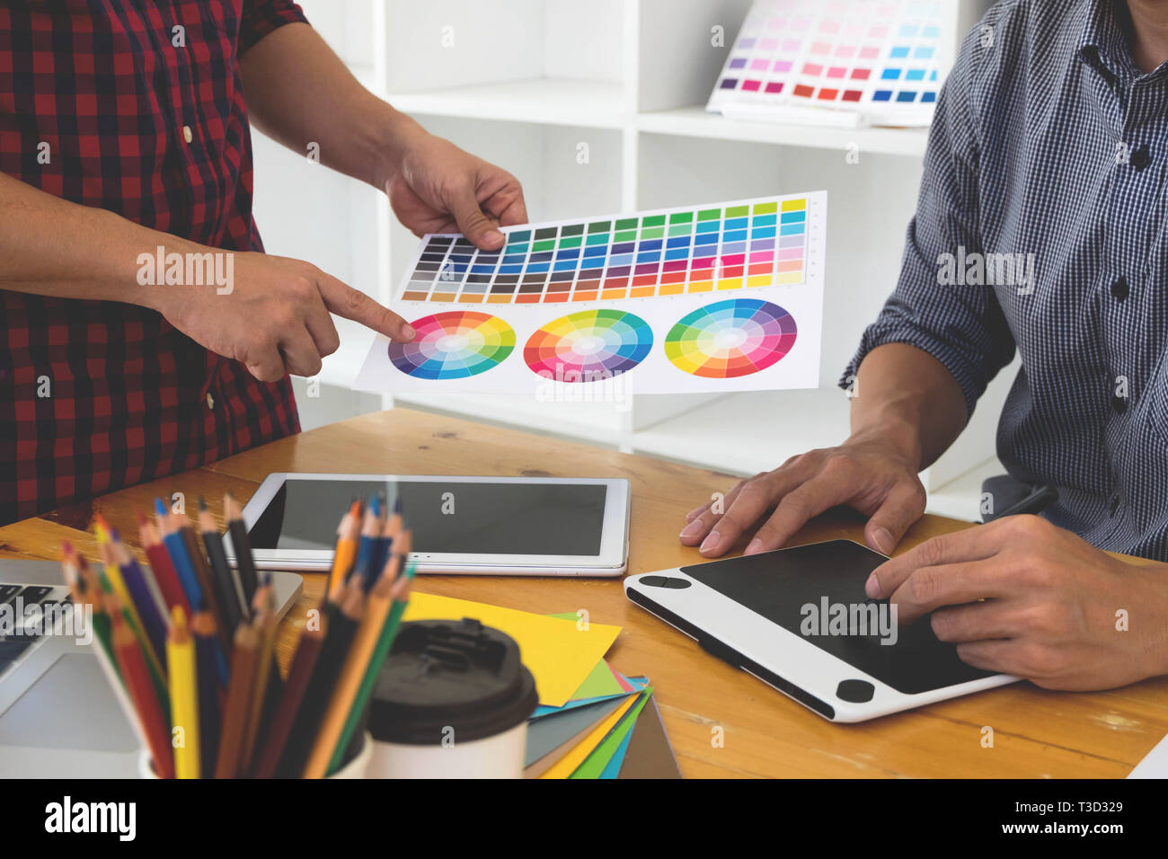 Graphic designers present colors from the color palette to their ...