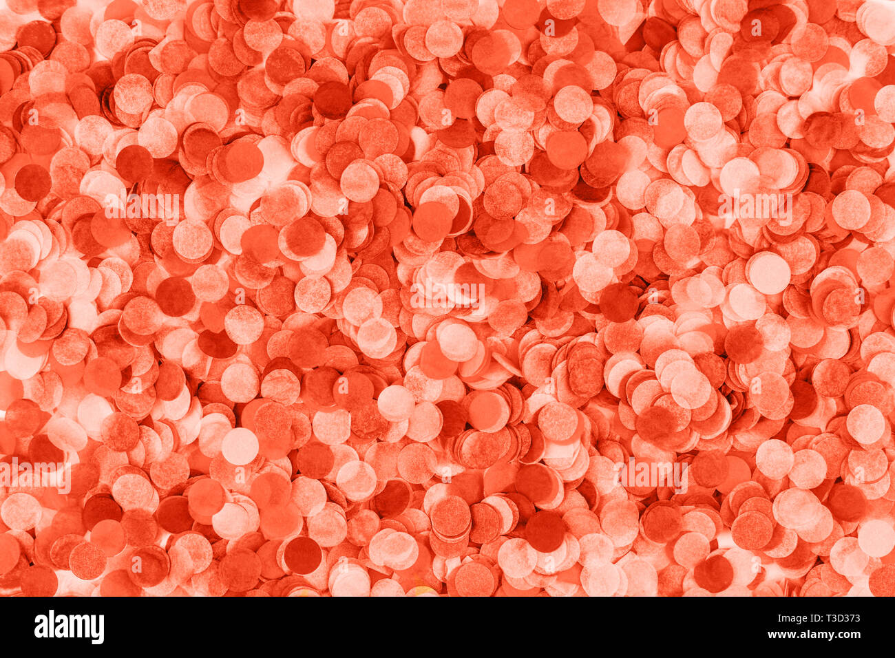 Bright coral confetti isolated on white background Stock Photo - Alamy