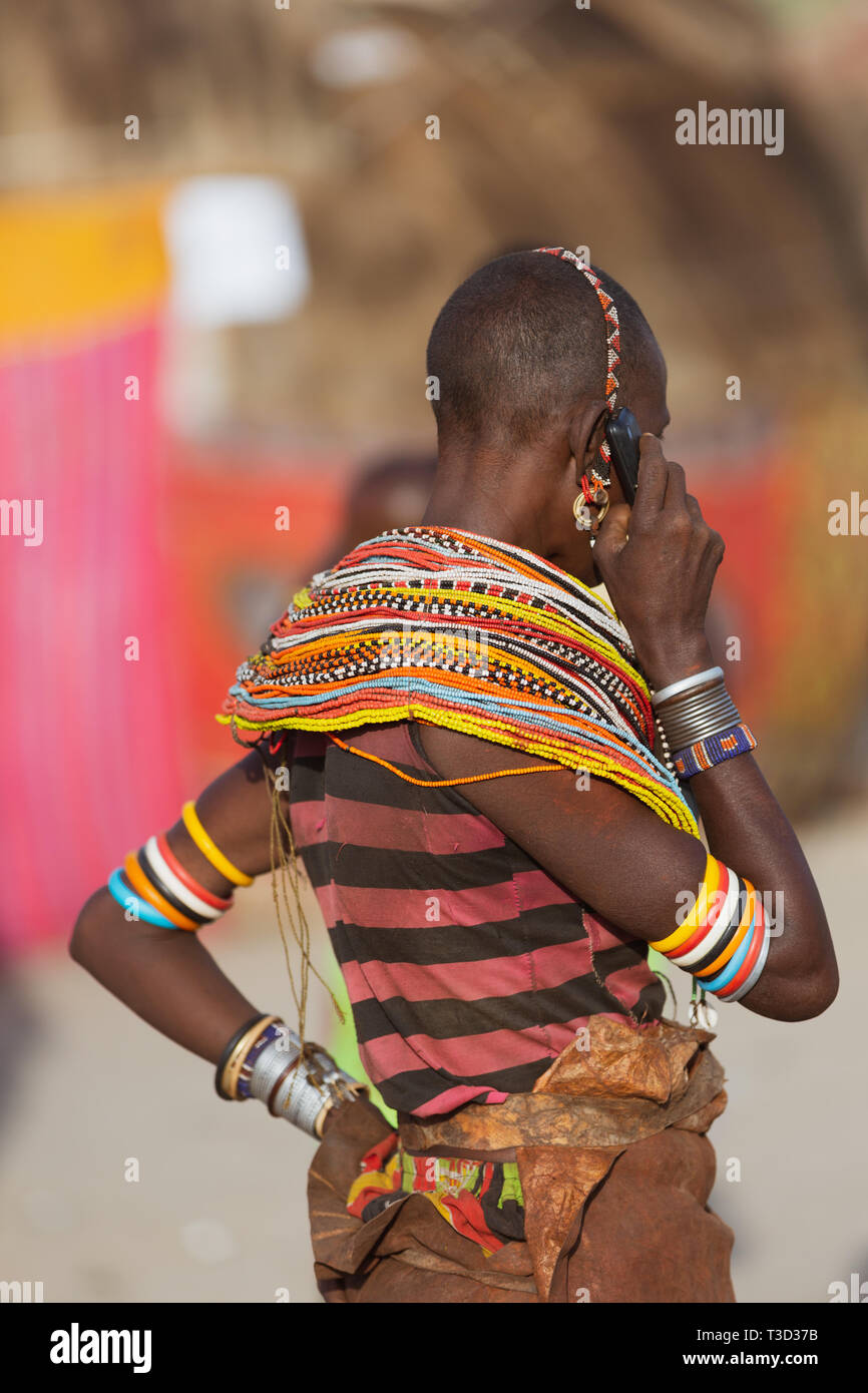 turkana woman wearing the hand made bead traditional jewerly talking on ...