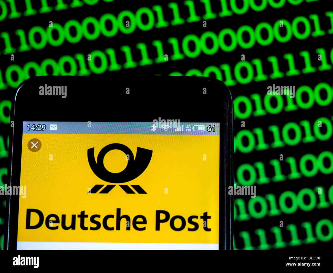 In this photo illustration a Deutsche Post logo seen displayed on a ...