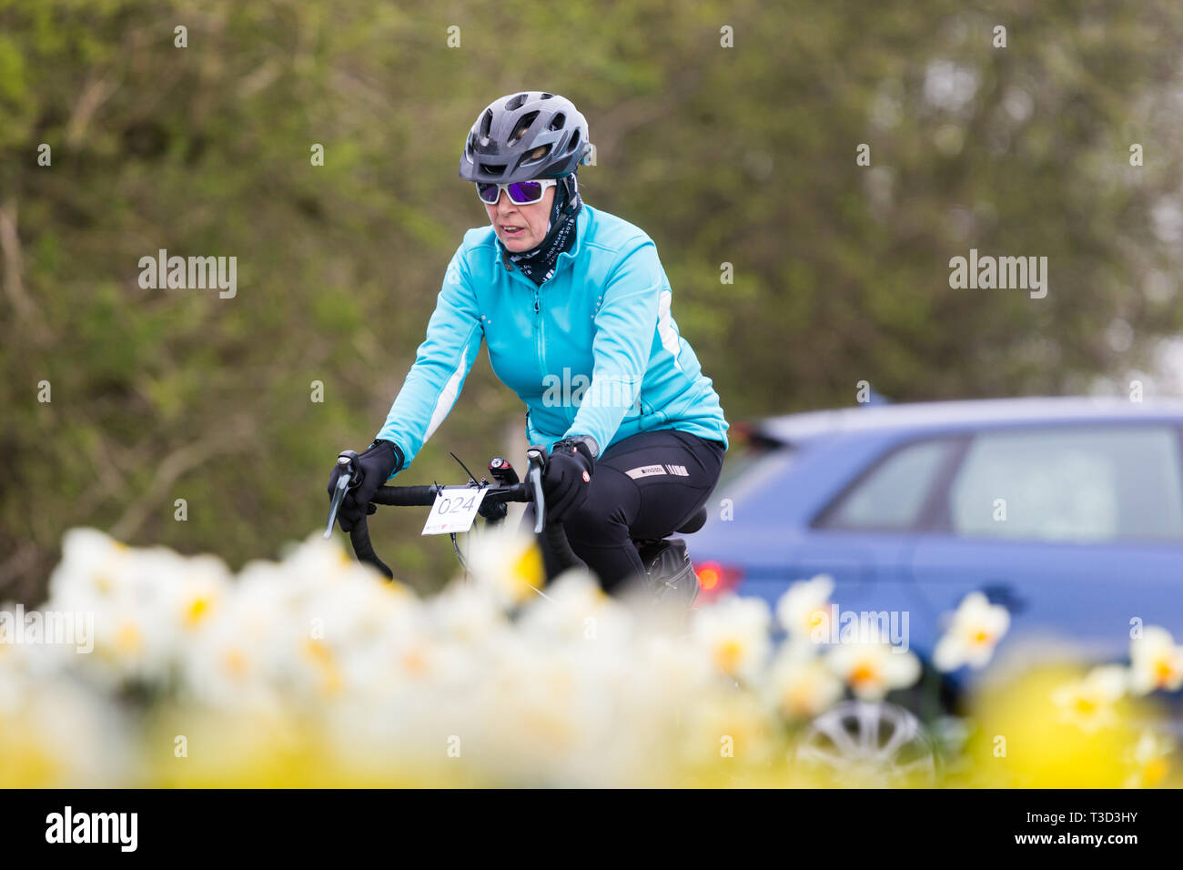 Middle aged woman cyclist in full cycling gear UK Stock Photo - Alamy