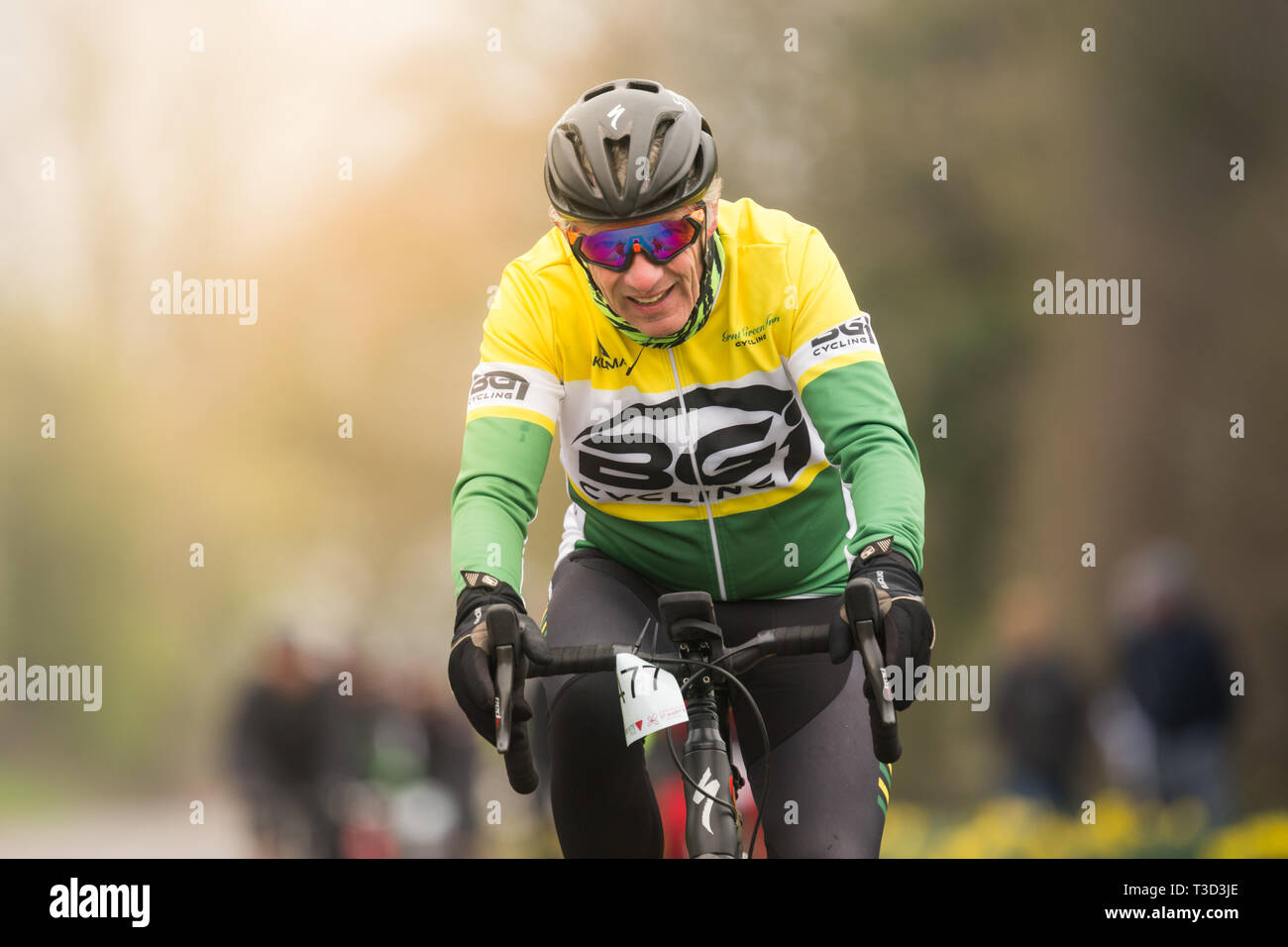 Man cycling on road, UK Stock Photo - Alamy