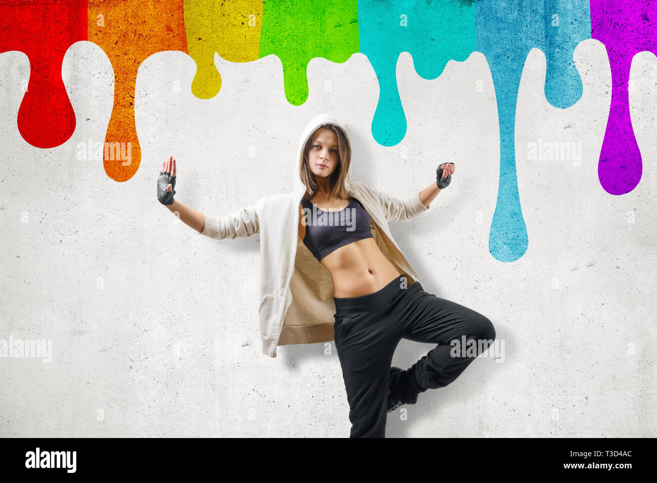Street dance young girl dancing on rainbow colorful wall background ...