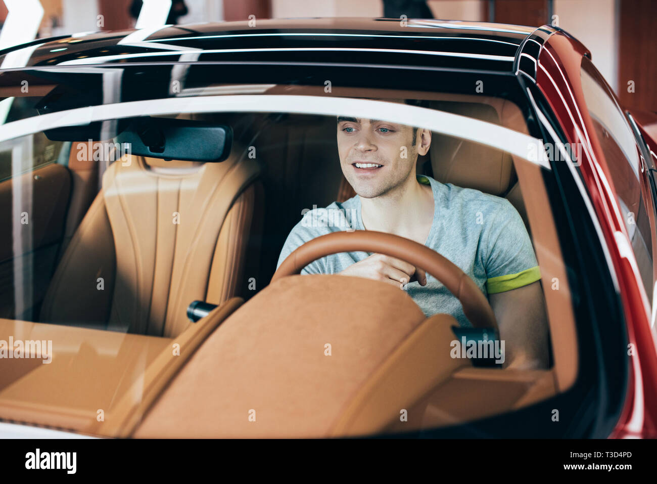 Man sitting by steering wheel hi-res stock photography and images - Alamy