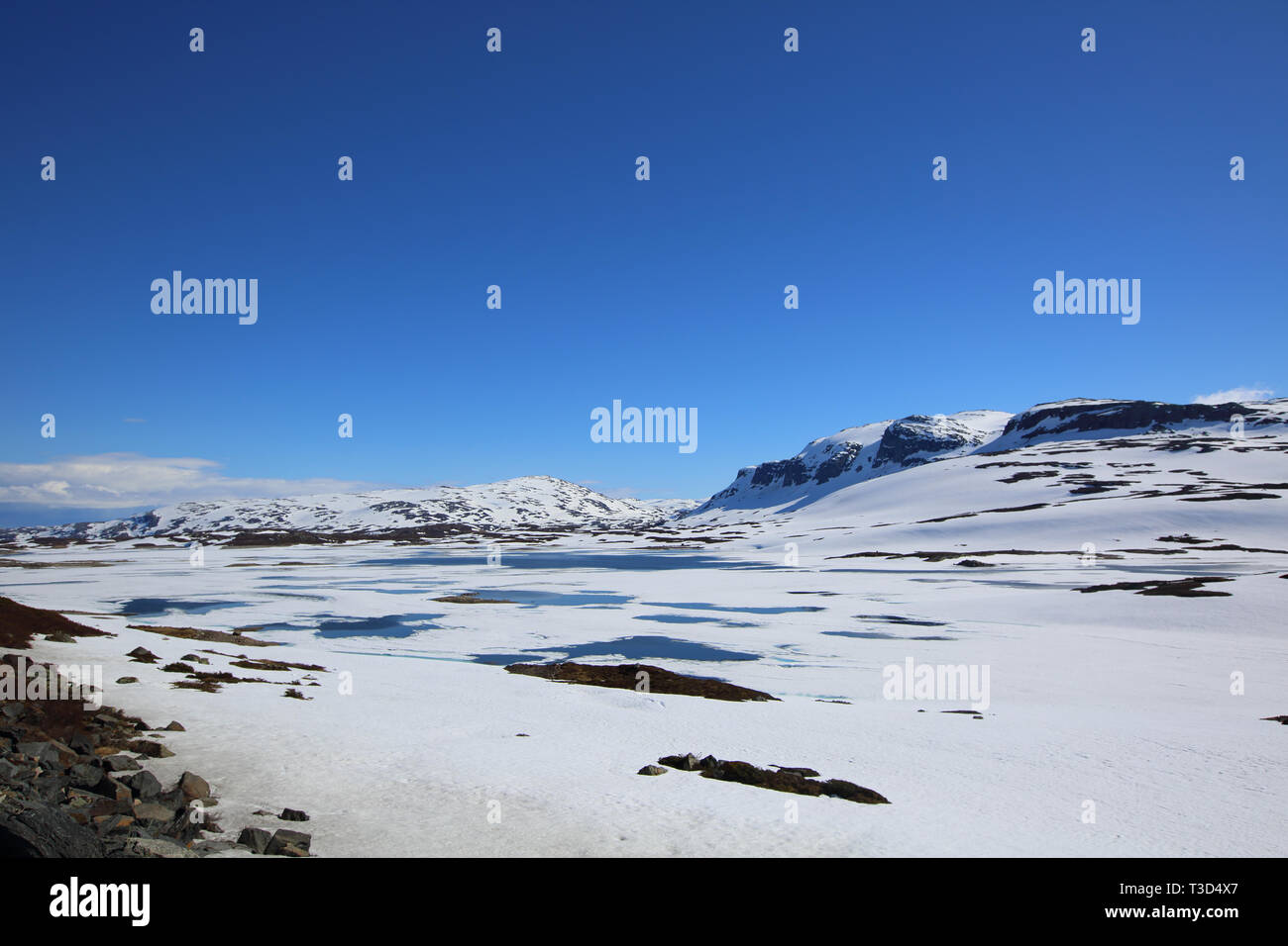 Spring valley landscape with mountains and melting snow, Norway Stock ...