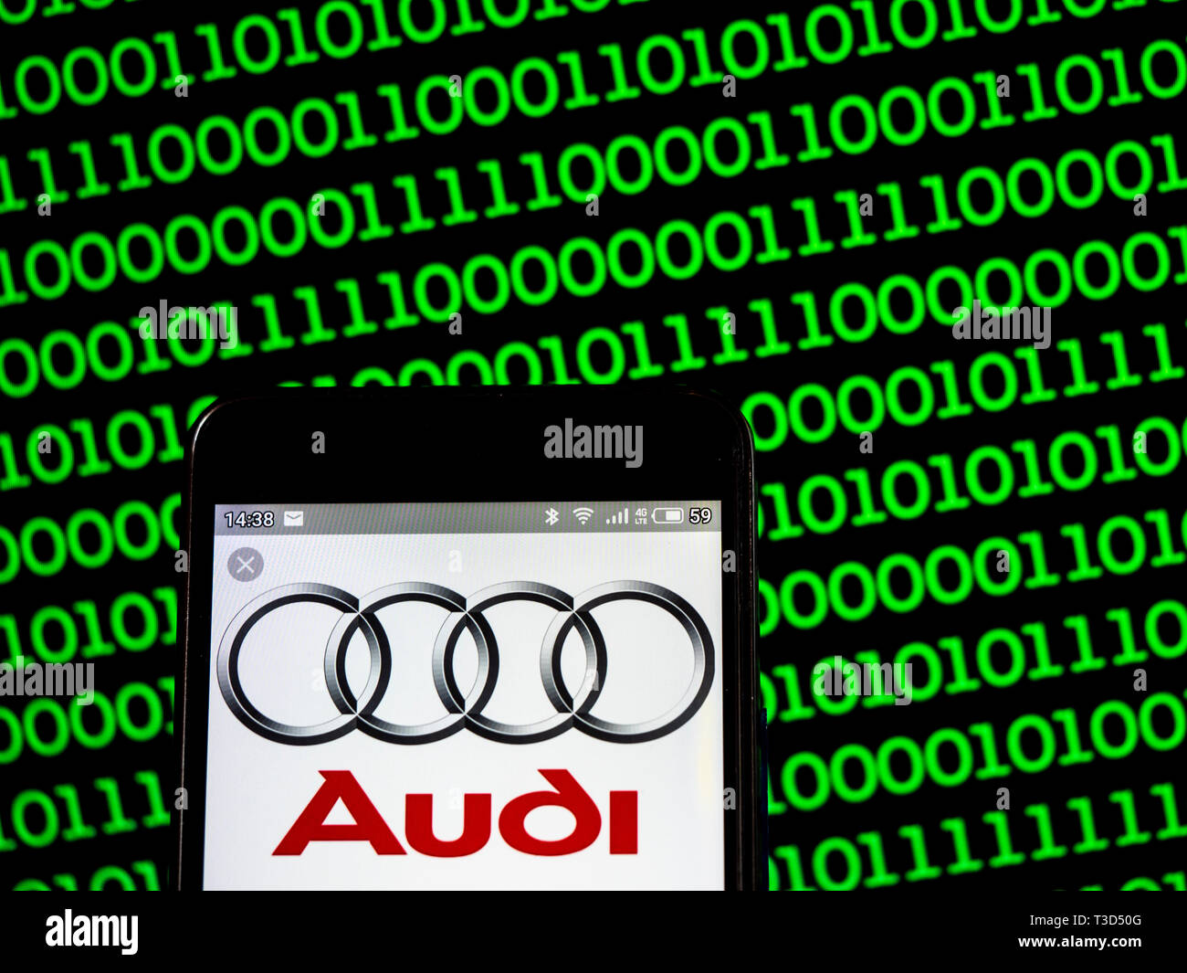 In this photo illustration an Audi AG logo seen displayed on a smart ...