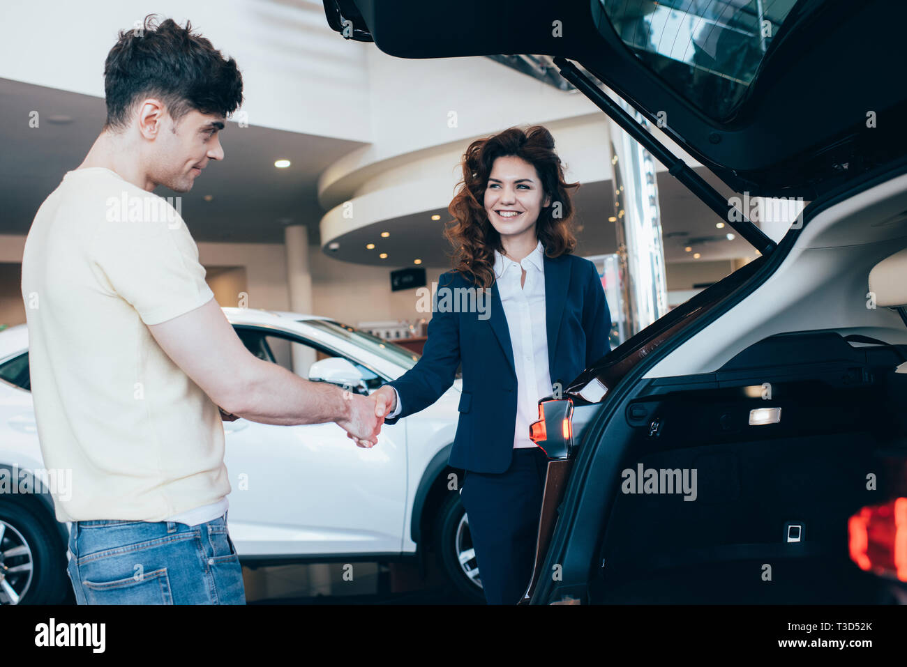 Two hands shaking car in hi-res stock photography and images - Alamy