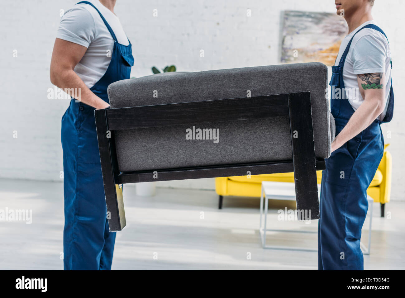 Two men moving furniture apartment hi-res stock photography and images ...